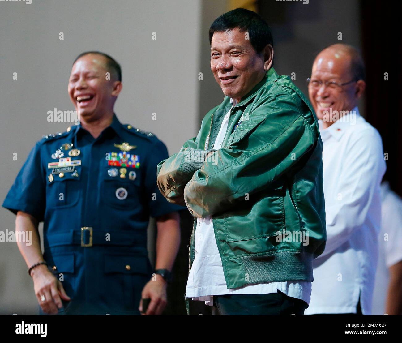Philippine President Rodrigo Duterte wears a pilot's jacket which was ...