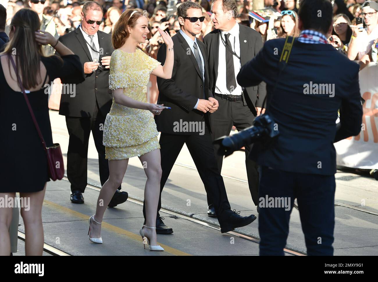 Emma Stone greets fans as she arrives at the "La La Land" premiere on ...