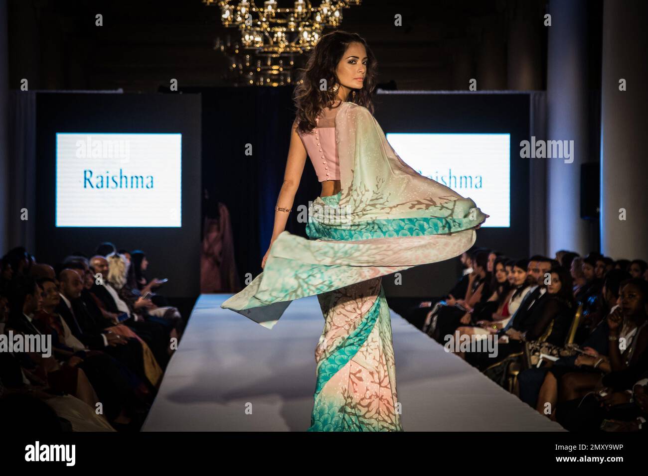 A model wears creations from fashion designers Raischma and Lucy Choi ...