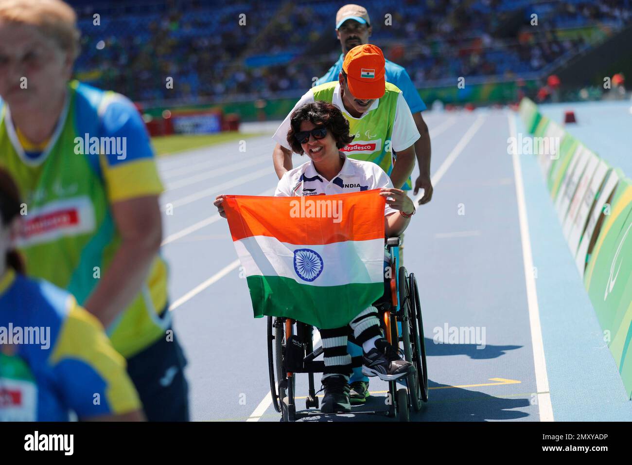 India's Deepa Malik holds her nation's flag after winning the silver ...
