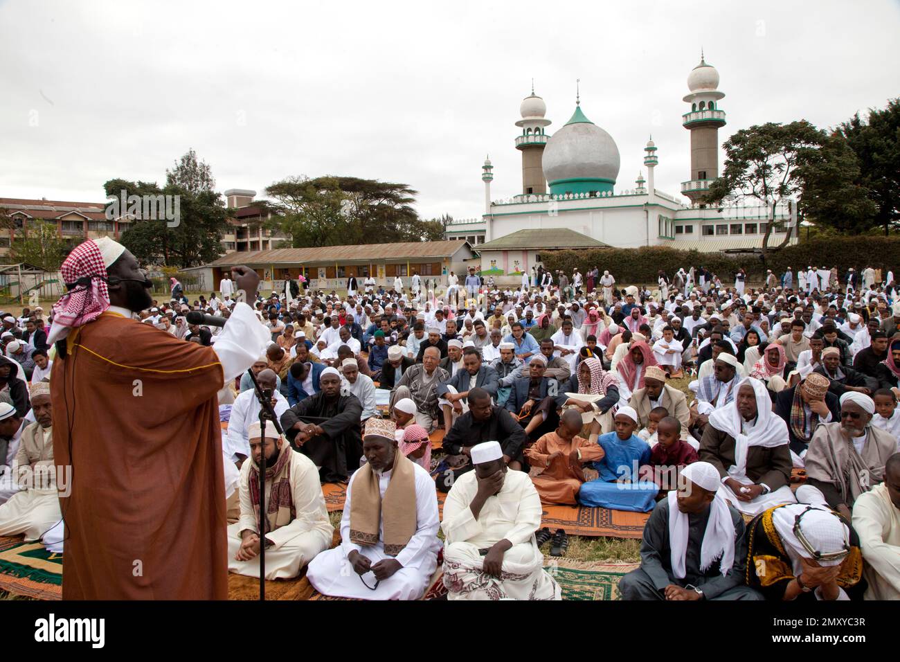 Kenyan Muslims listen to sermon by the Imam as they gather for prayers ...