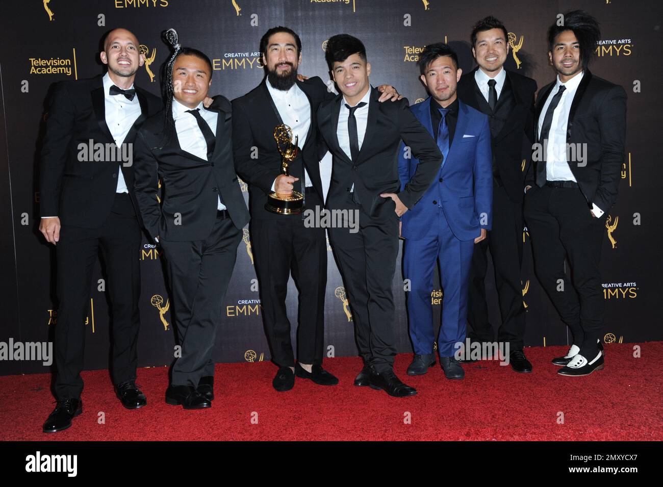 Quest Crew poses in the press room with the award for outstanding ...