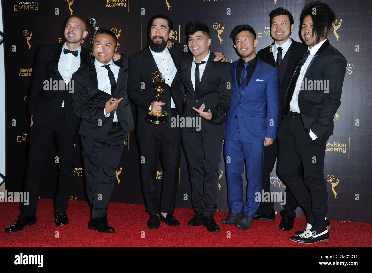 Quest Crew poses in the press room with the award for outstanding ...