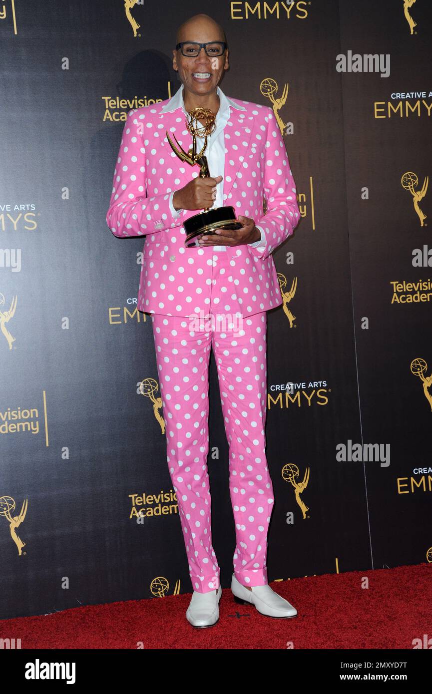 RuPaul Charles poses in the press room with the award for outstanding ...