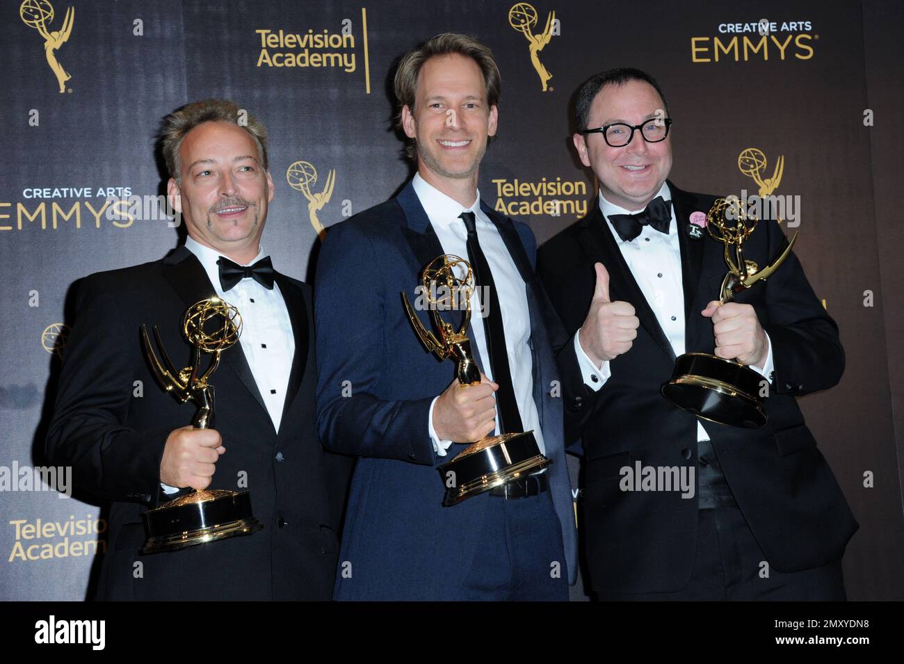Jason Howard, from left, David Korns, and Joe Celli pose in the press ...