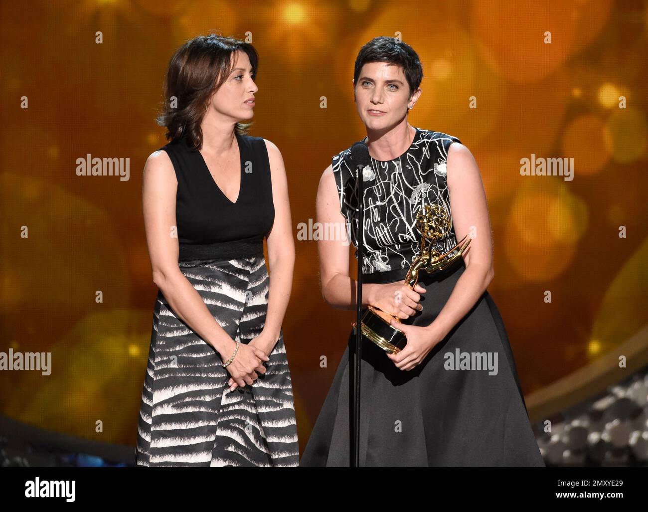 Laura Ricciardi, right, and Moira Demos accept the award for ...