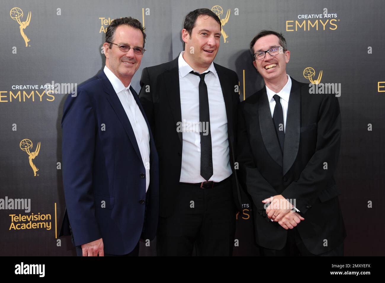 John Orlando, from left, Stephen Shaw, Matthew Senreich arrive at night ...