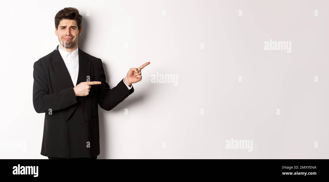 Image of devestated man in party suit, crying and complaining, pointing ...