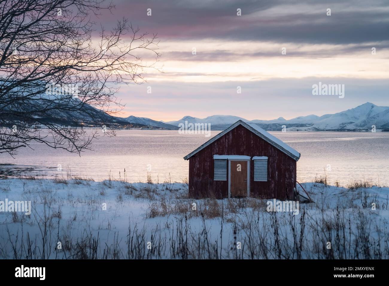 A typical red and colorful cottage of the Norwegian culture and ...