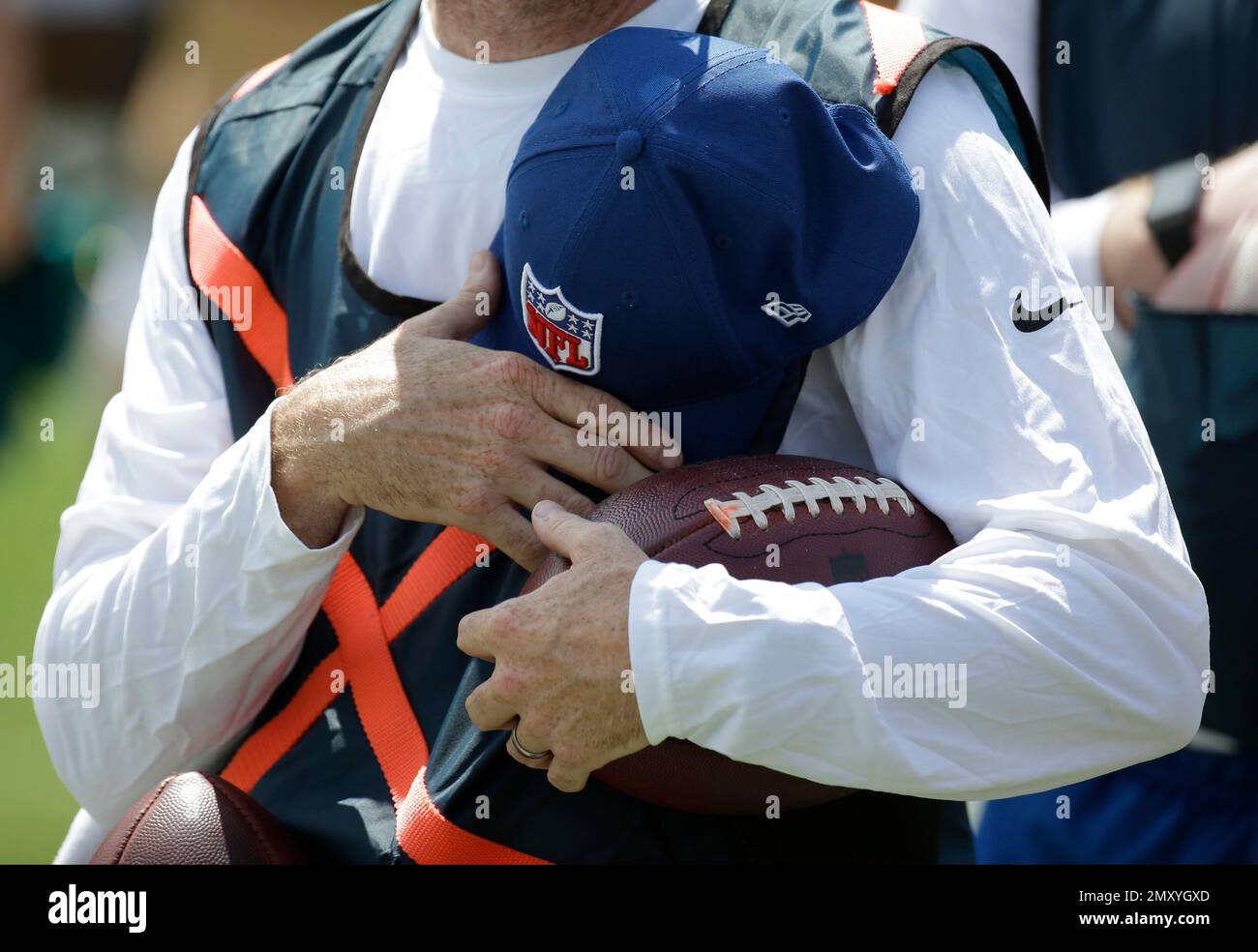 A ball boy holds his cap over his heart during a pre-game ceremony in ...