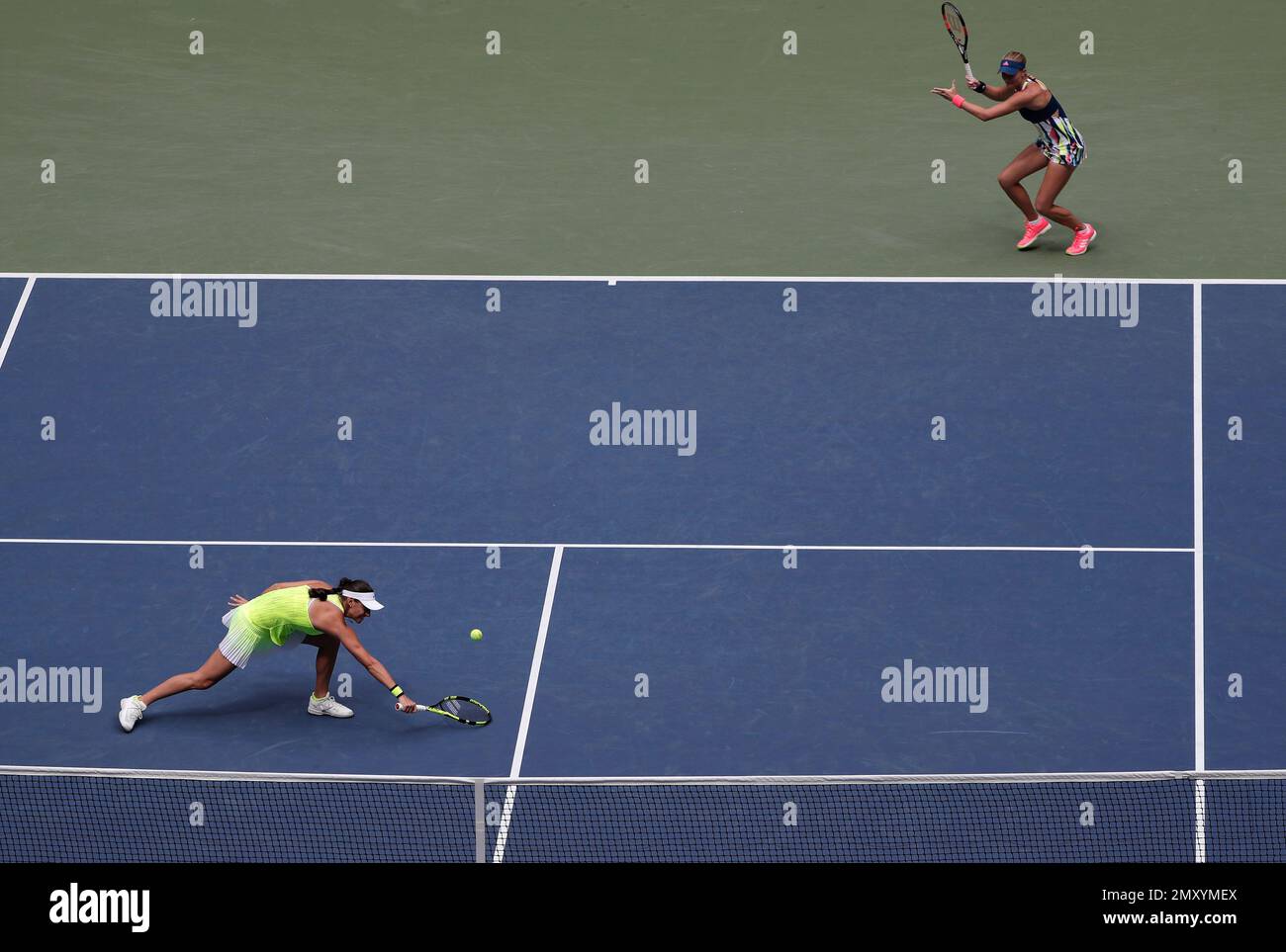 Caroline Garcia, of France, returns a shot with partner Kristina ...