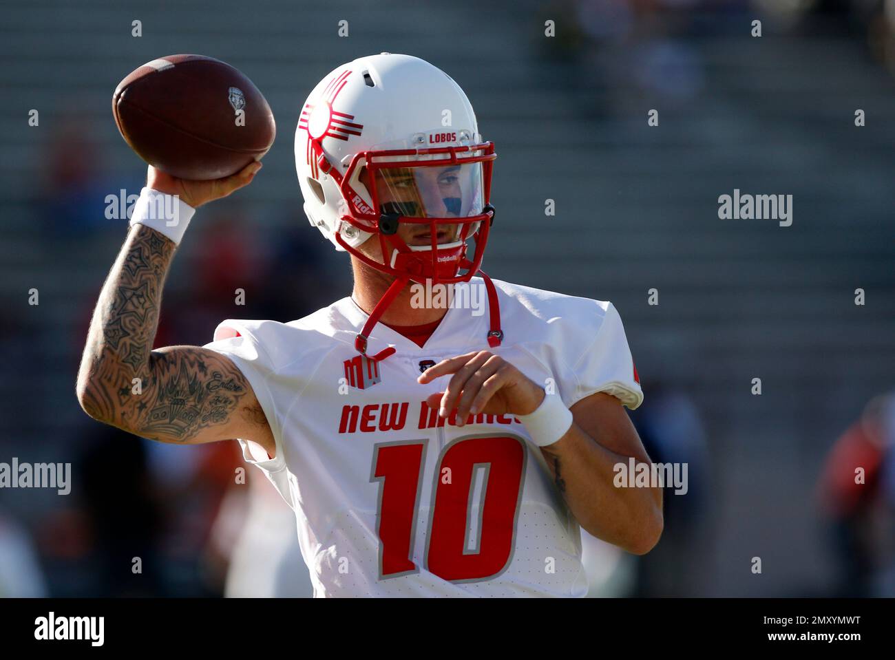 New Mexico quarterback Austin Apodaca warms up before an NCAA college ...