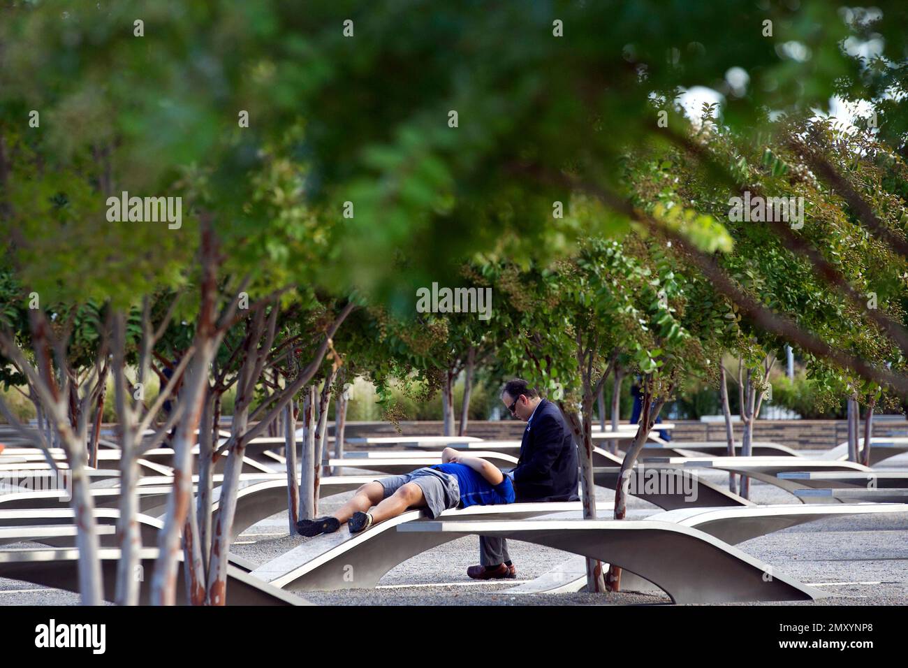 Two men visit the Pentagon Memorial prior to a Sept. 11 observance ...