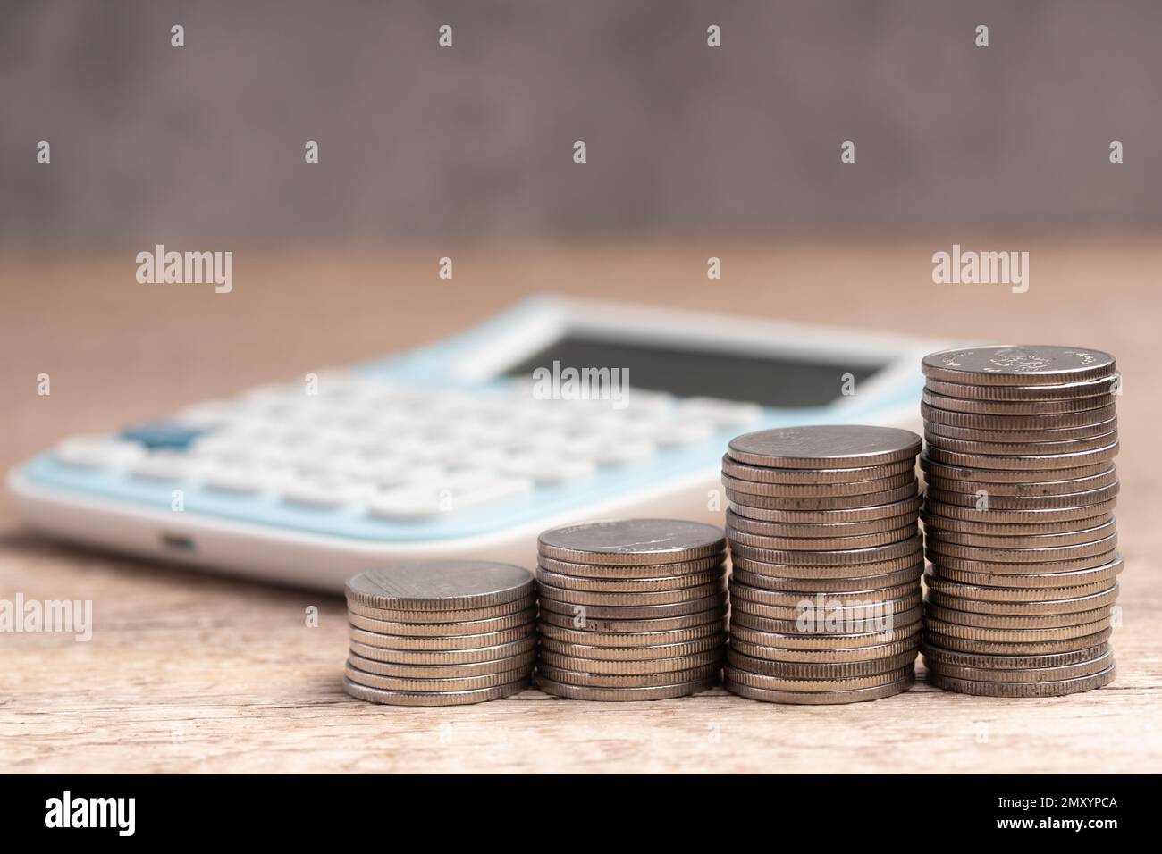 Money with calculator on brown background.Cost calculation concept ...