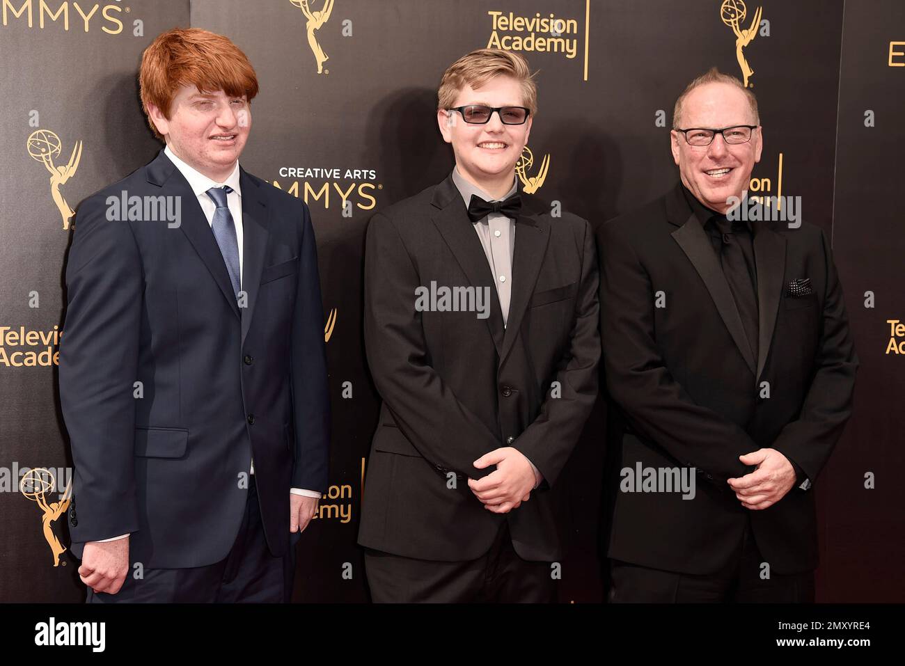 Mark Blutman, from right, Liam Blutman and Luke Blutman arrive at night ...
