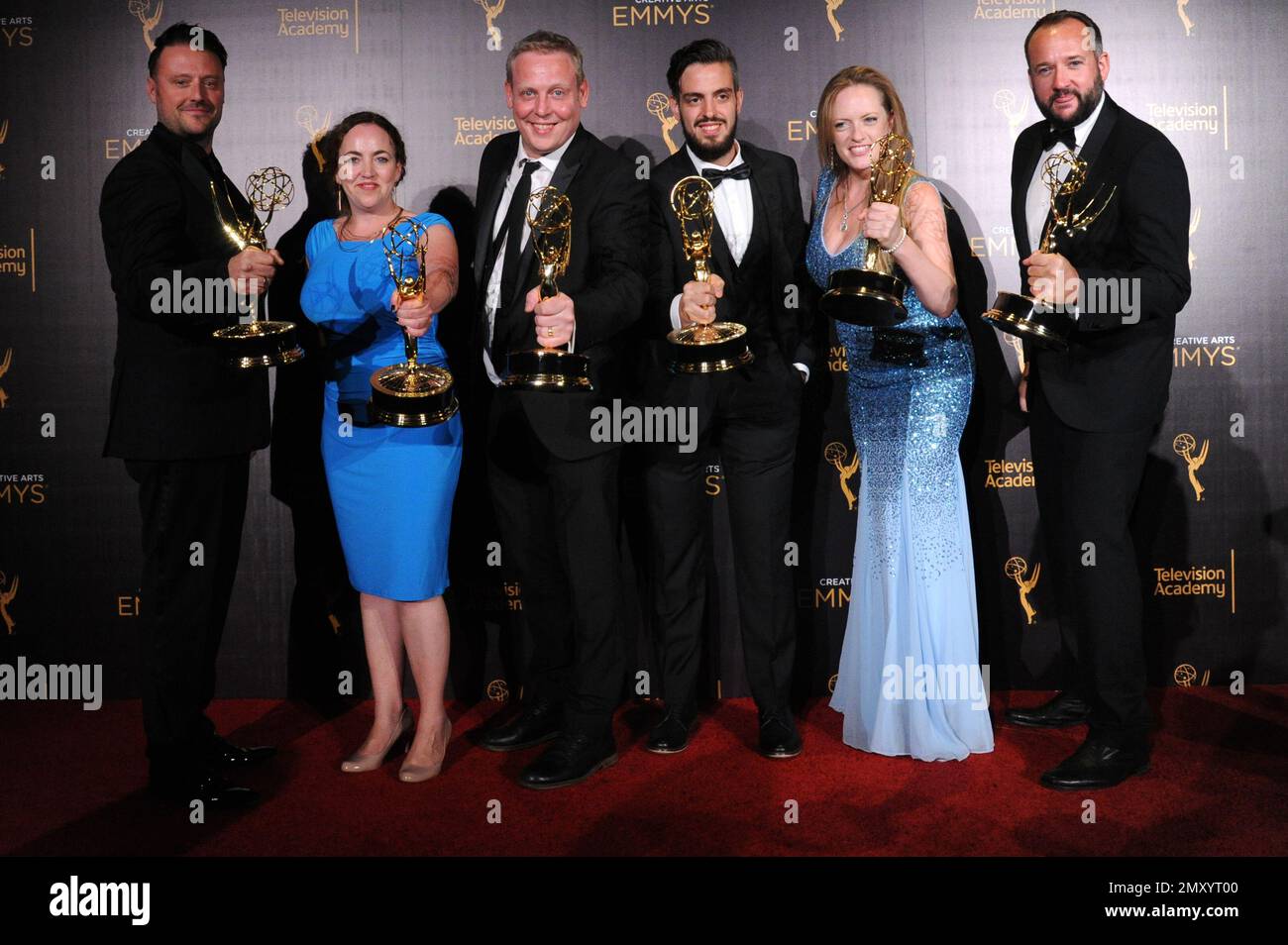 The team of Sherlock poses in the press room with their awards for ...