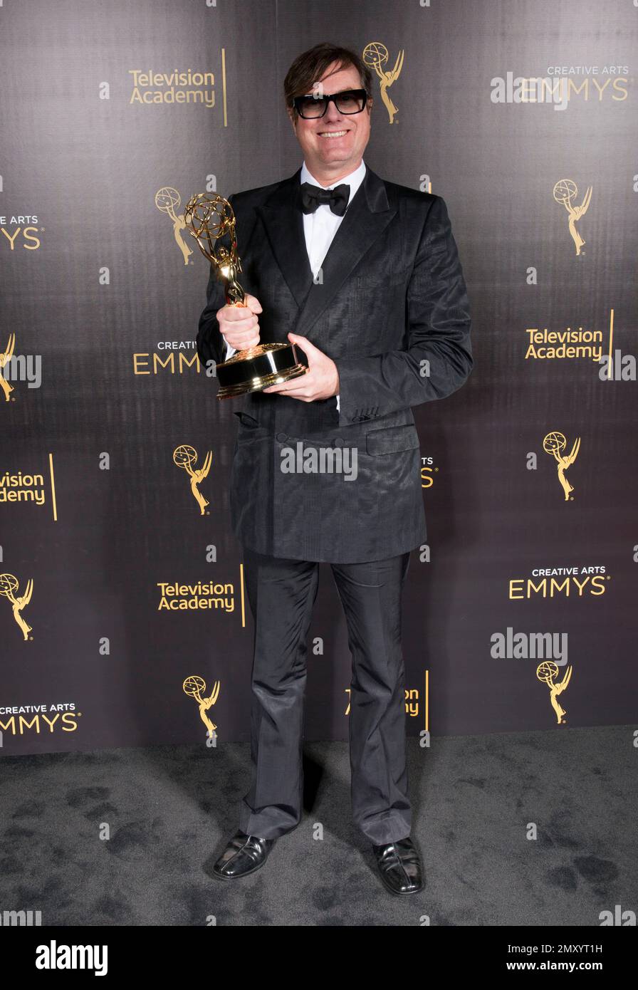 EXCLUSIVE - James Hawkinson poses for a portrait with the award for ...