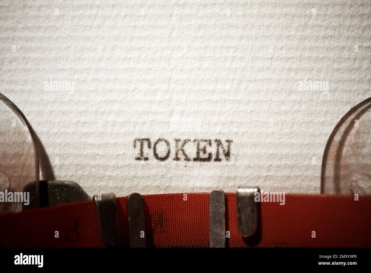 Token word written with a typewriter Stock Photo - Alamy