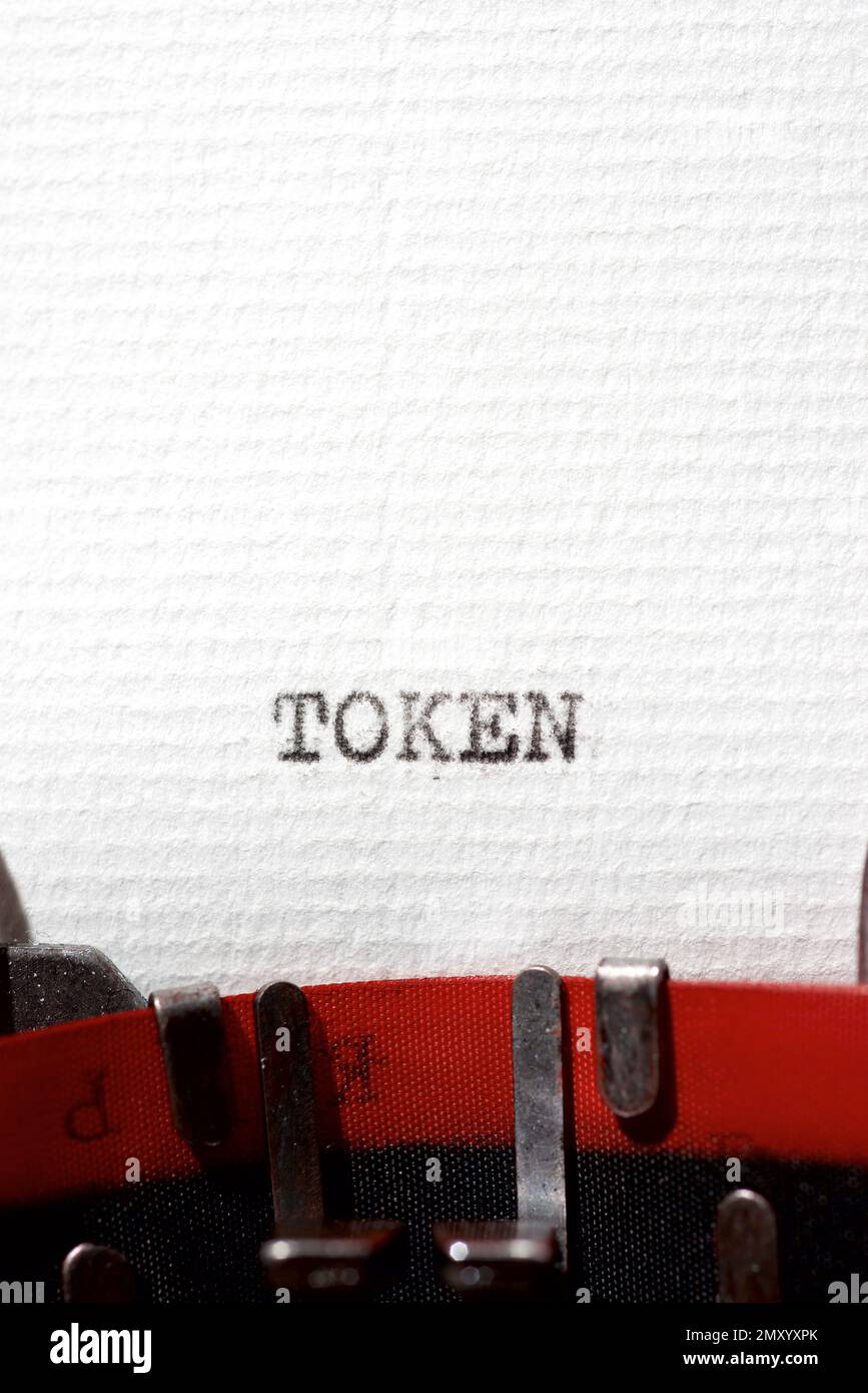Token word written with a typewriter Stock Photo - Alamy