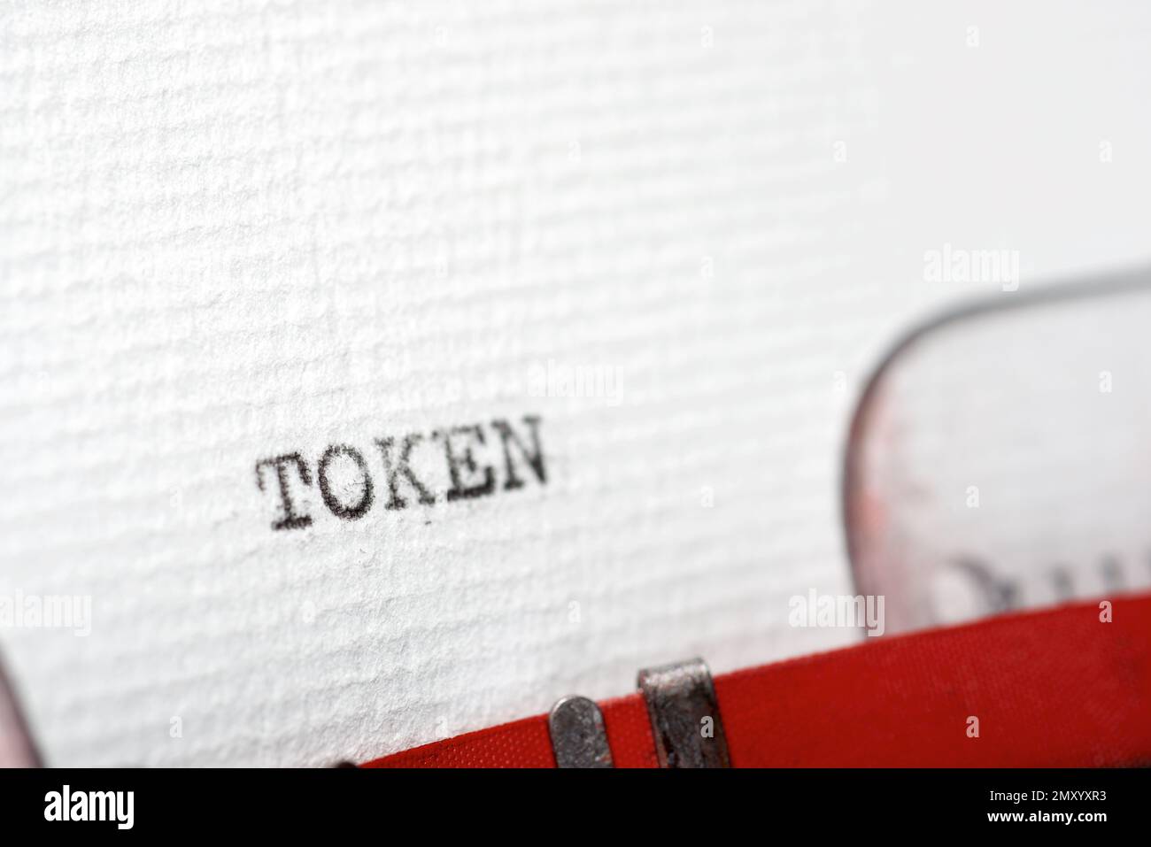 Token word written with a typewriter Stock Photo - Alamy