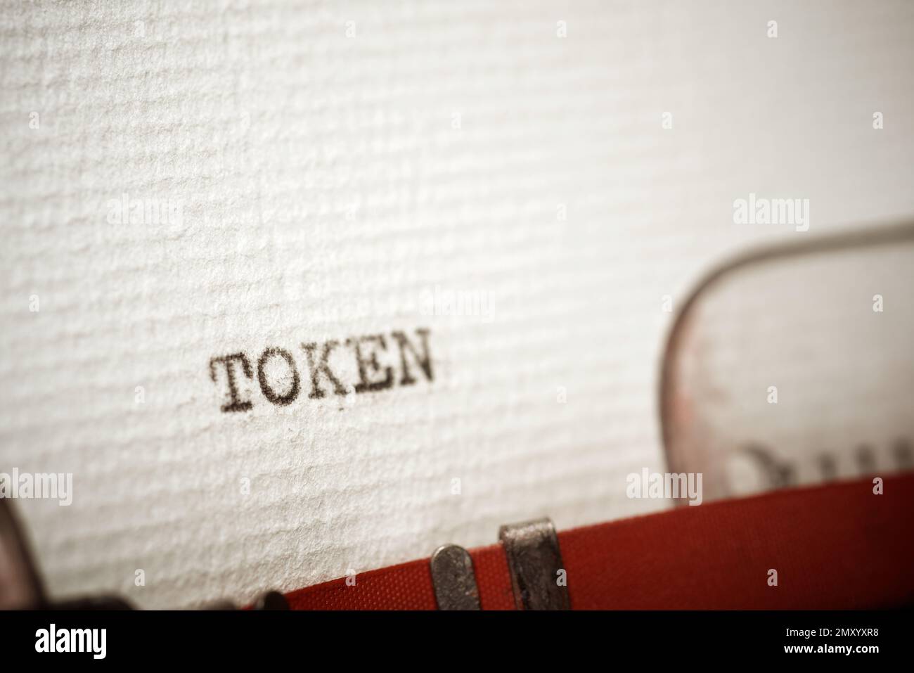 Token word written with a typewriter Stock Photo - Alamy