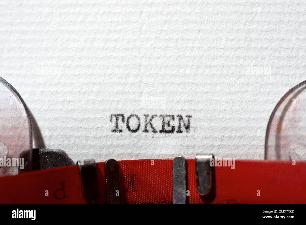 Token word written with a typewriter Stock Photo - Alamy