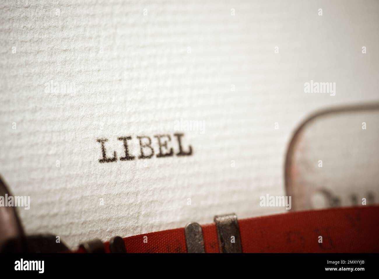 Libel word written with a typewriter Stock Photo - Alamy