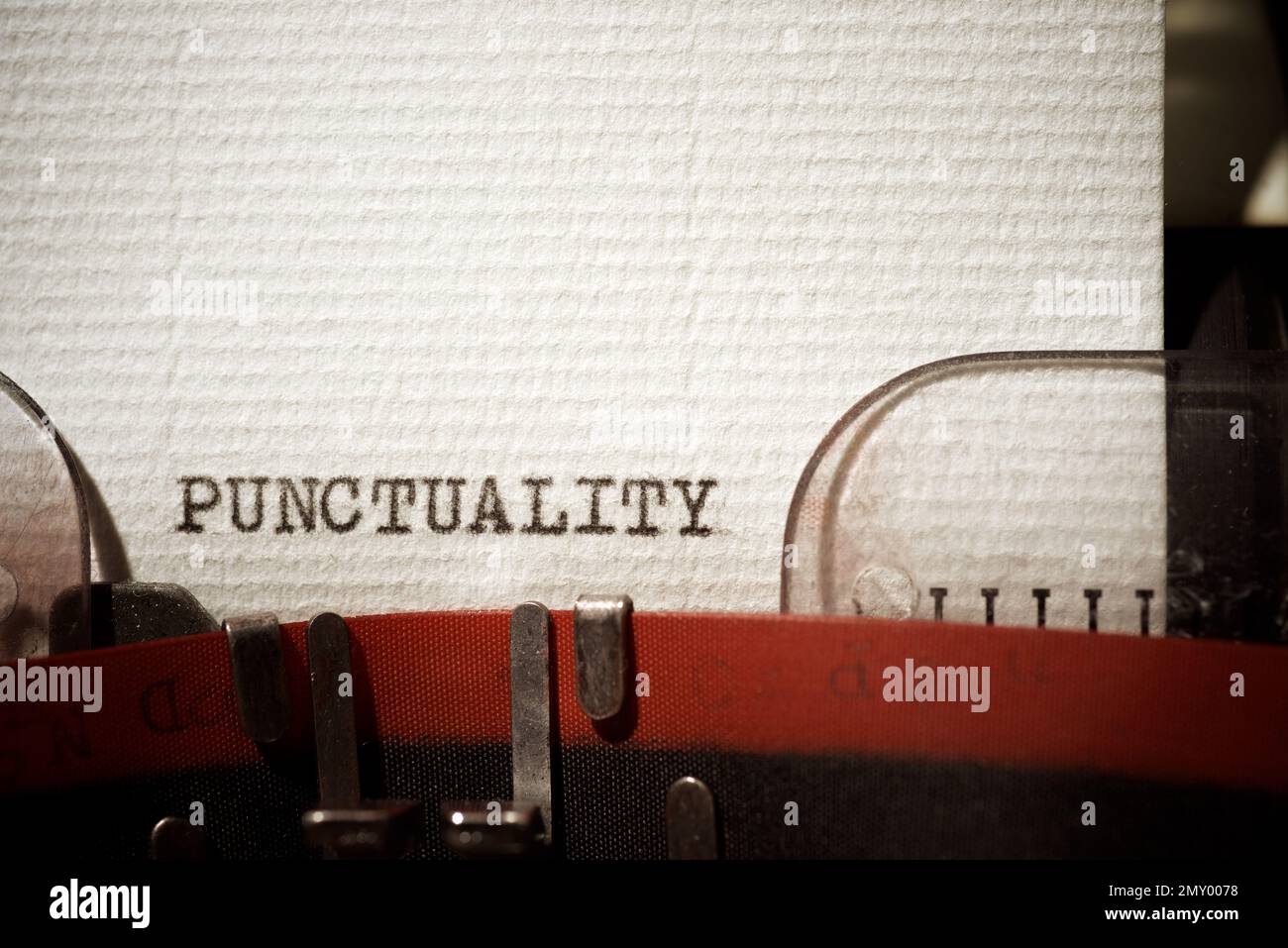 Punctuality word written with a typewriter Stock Photo - Alamy