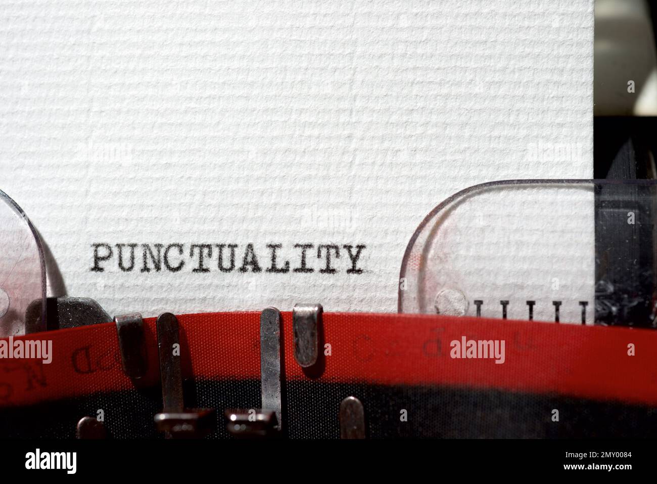 Punctuality word written with a typewriter Stock Photo - Alamy
