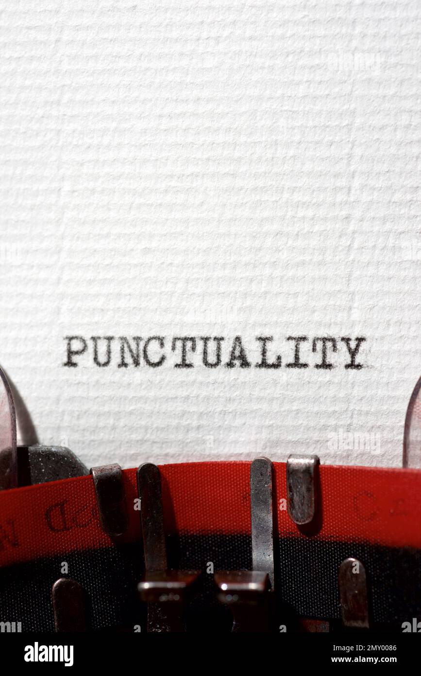 Punctuality word written with a typewriter Stock Photo - Alamy