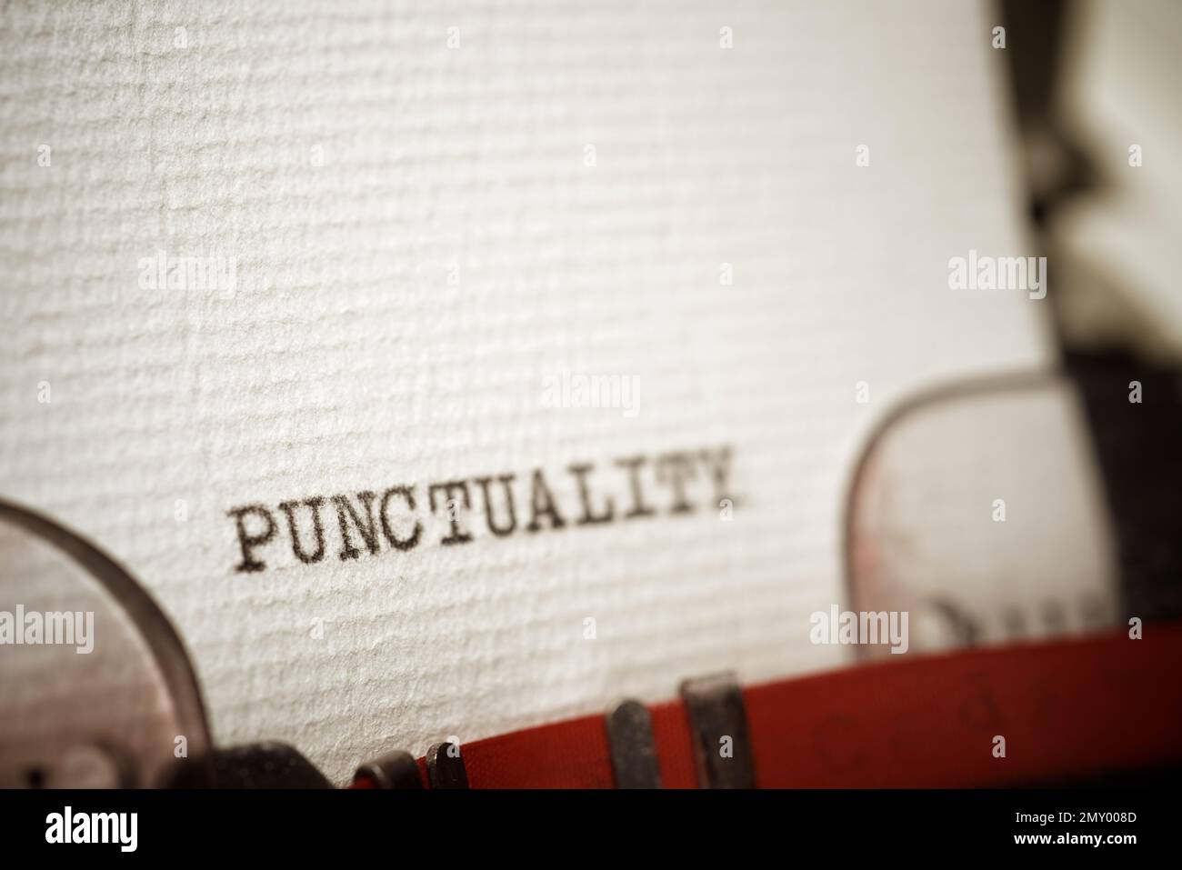 Punctuality word written with a typewriter Stock Photo - Alamy