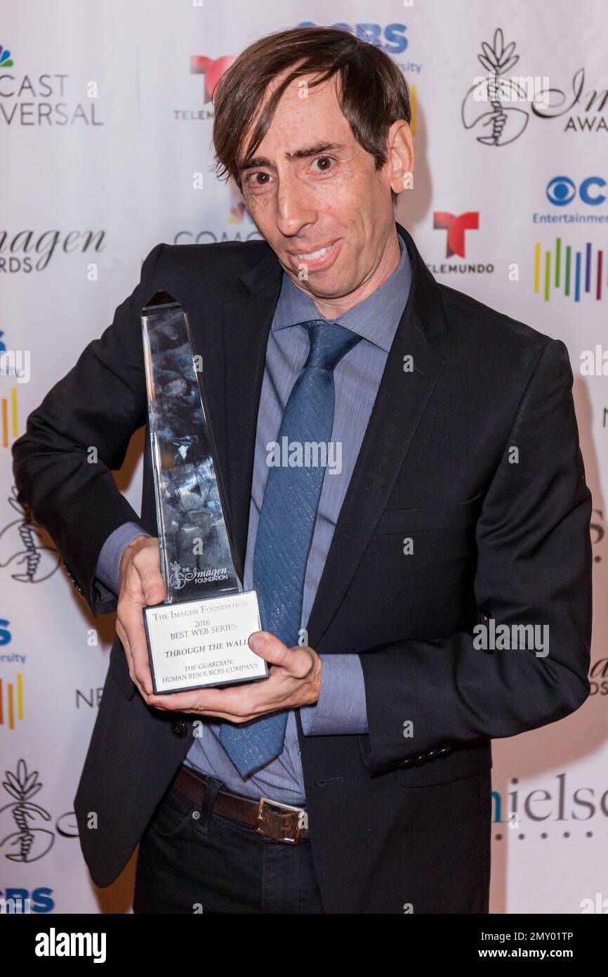 Director Tim Nackashi poses with the 2016 Best Web Series award for ...