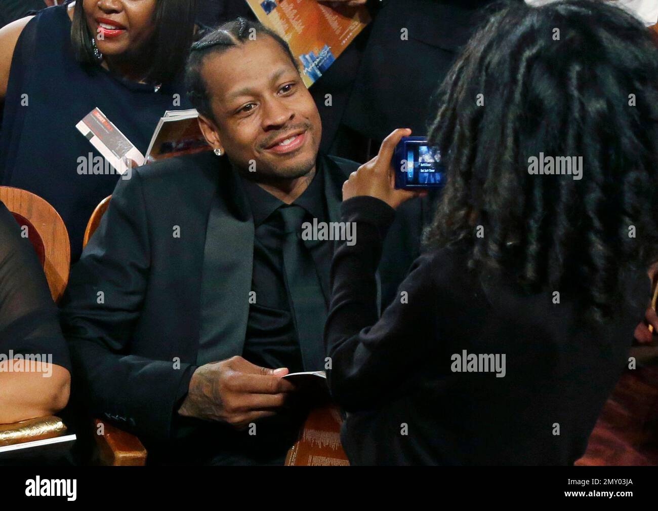 Basketball Hall of Fame inductee Allen Iverson poses for a young fan as ...