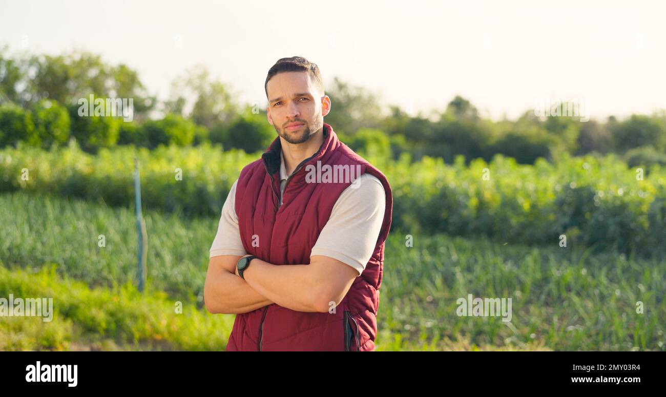 Portrait, sustainability and farmer man working outdoor on grass field ...