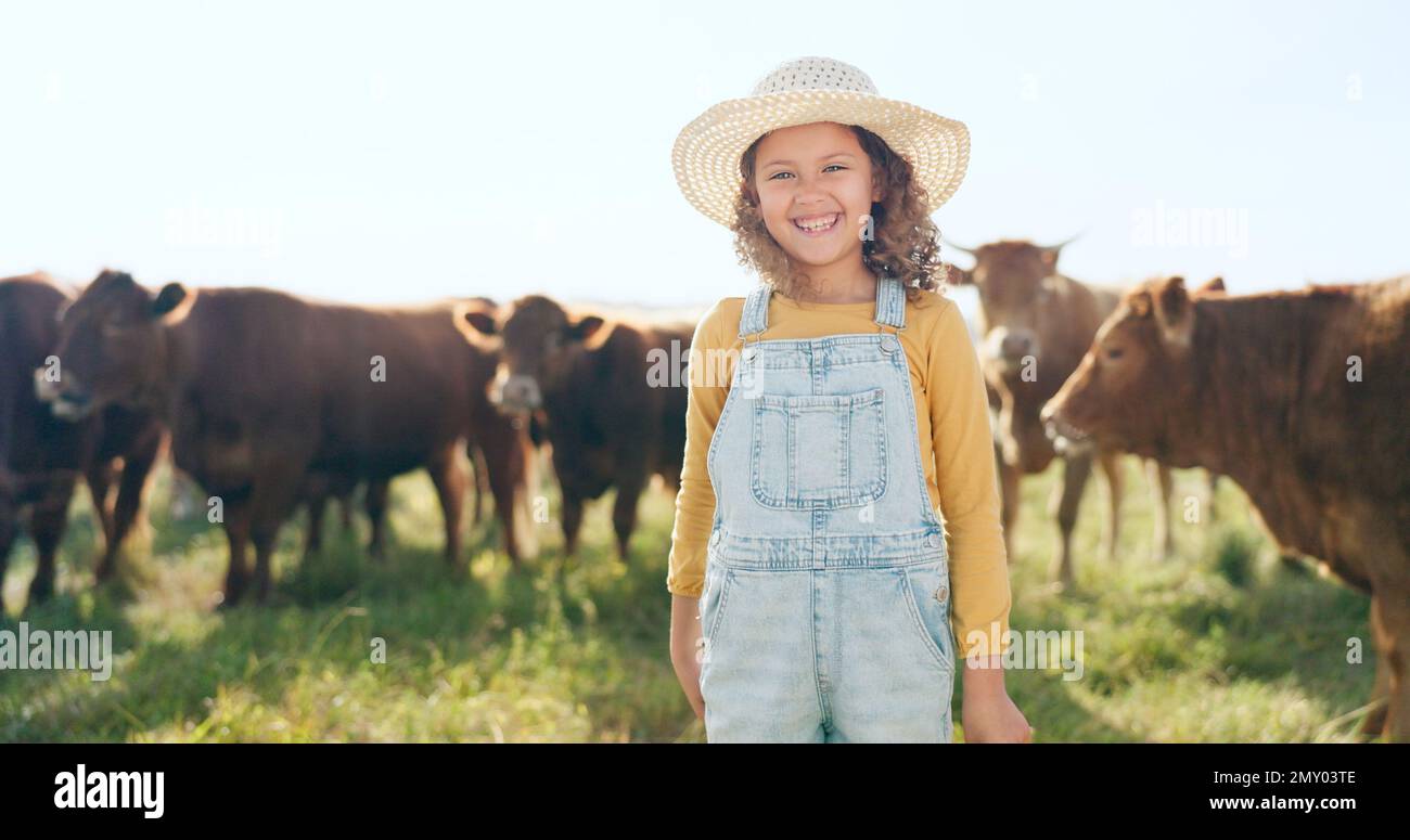 Happy child, farming and fun learning to care for animals, cows and ...