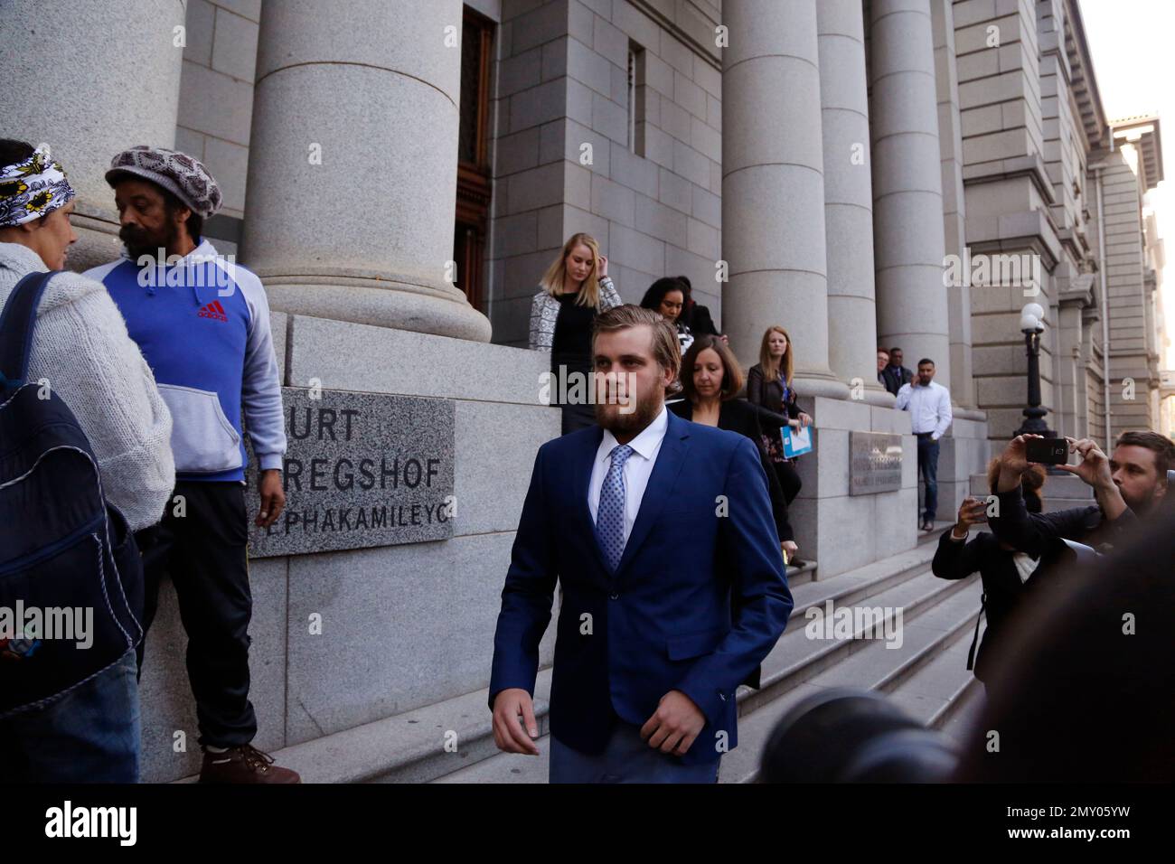 South African murder accused Henri van Breda, center, leaves the high ...
