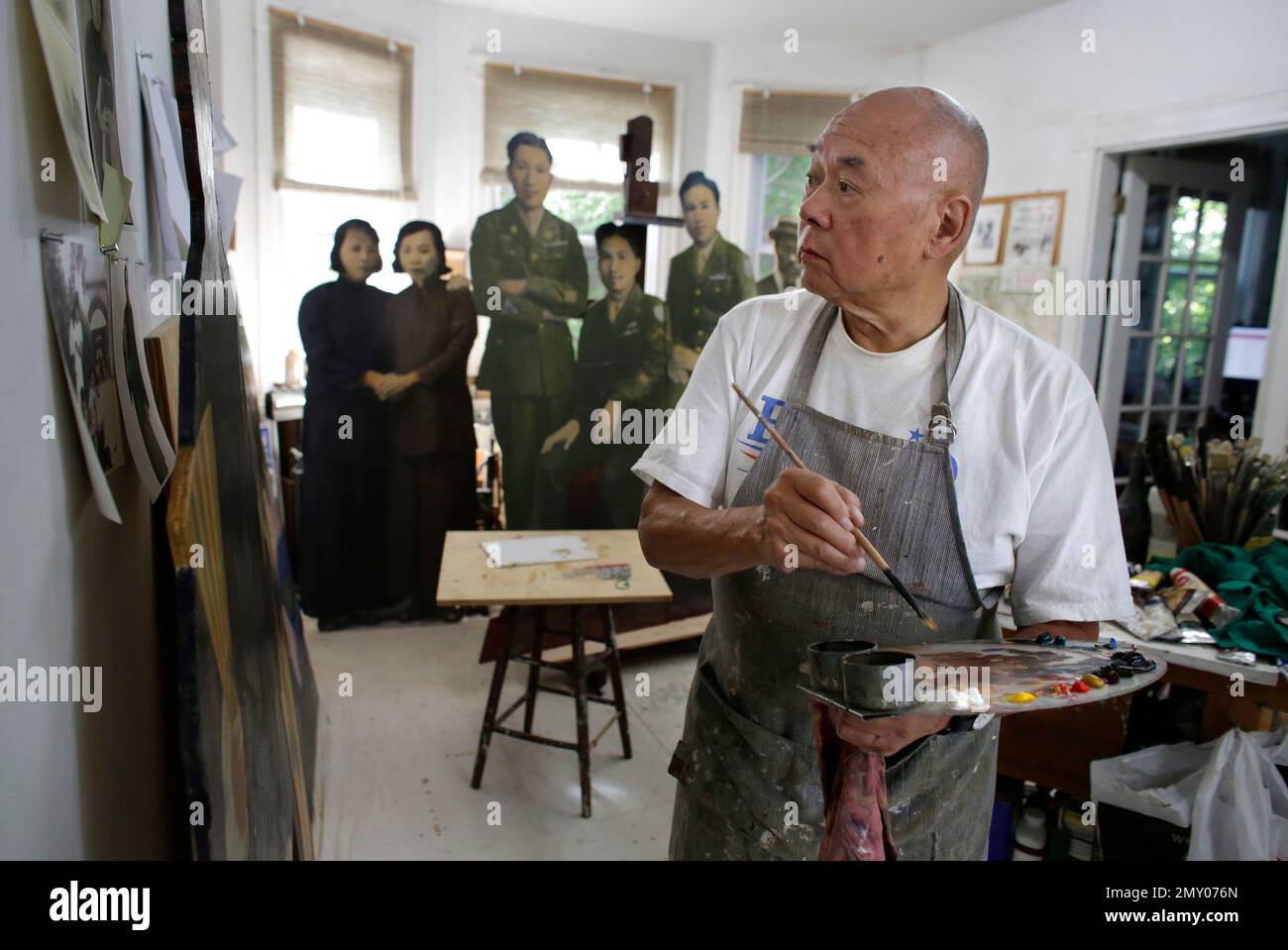In this Monday, Aug. 29, 2016 photo artist Wen-ti Tsen paints life ...