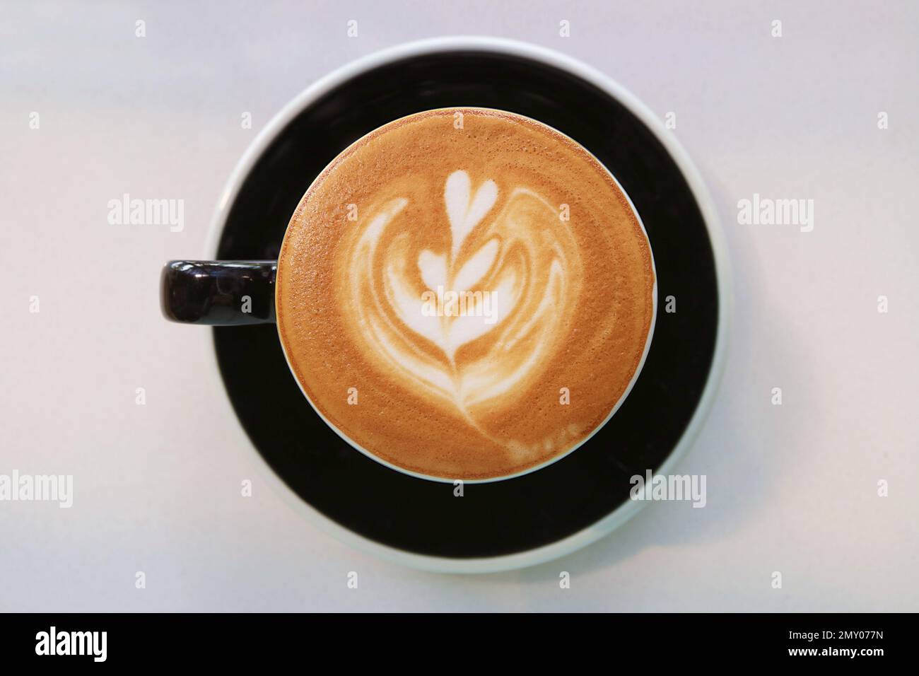 Top view of mouthwatering frothy cappuccino coffee with beautiful latte ...