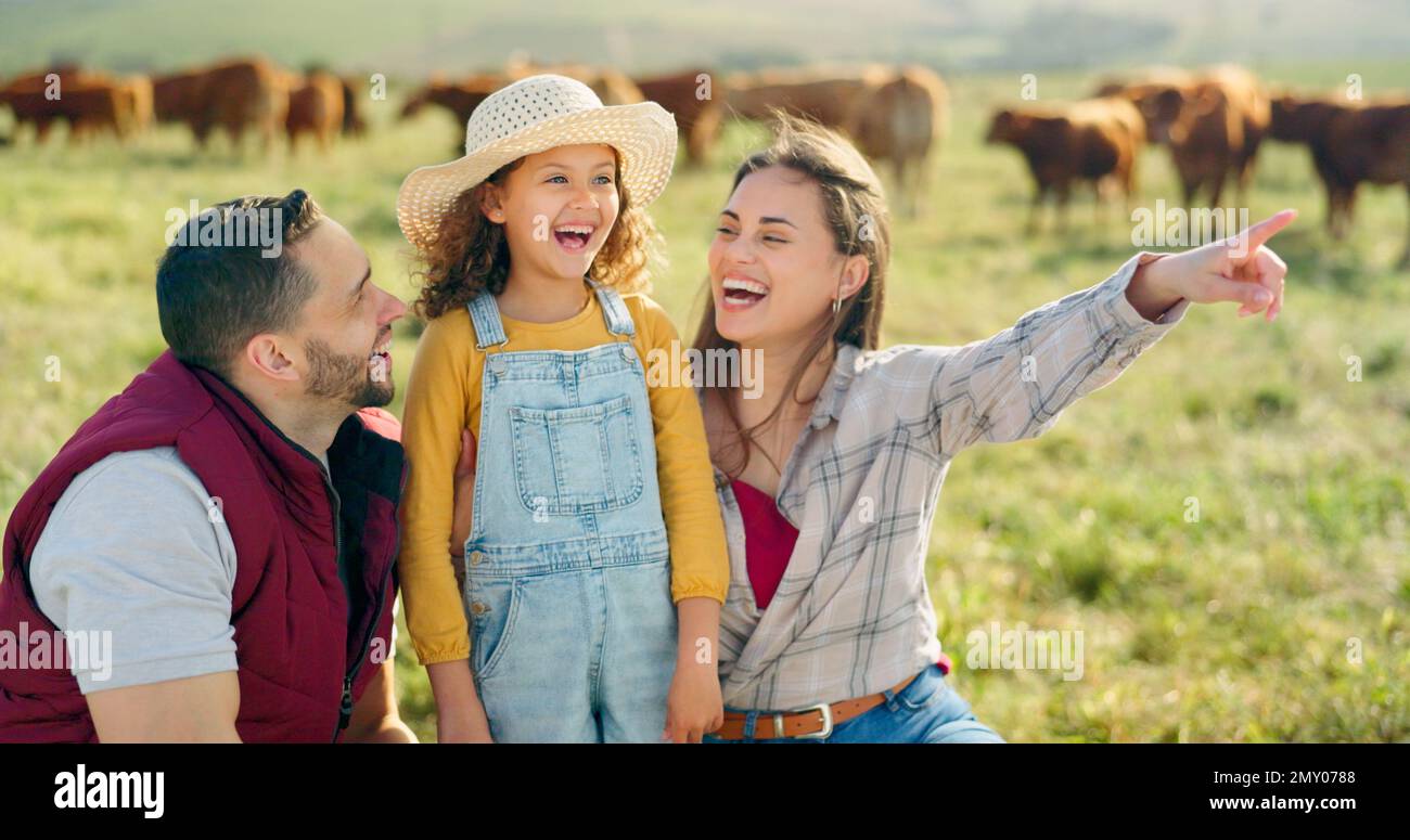 Happy family bonding on a cattle farm, happy, laughing and learning ...