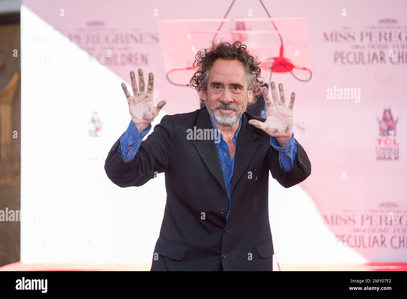 Tim Burton poses at his hand and footprint ceremony held at the TCL ...