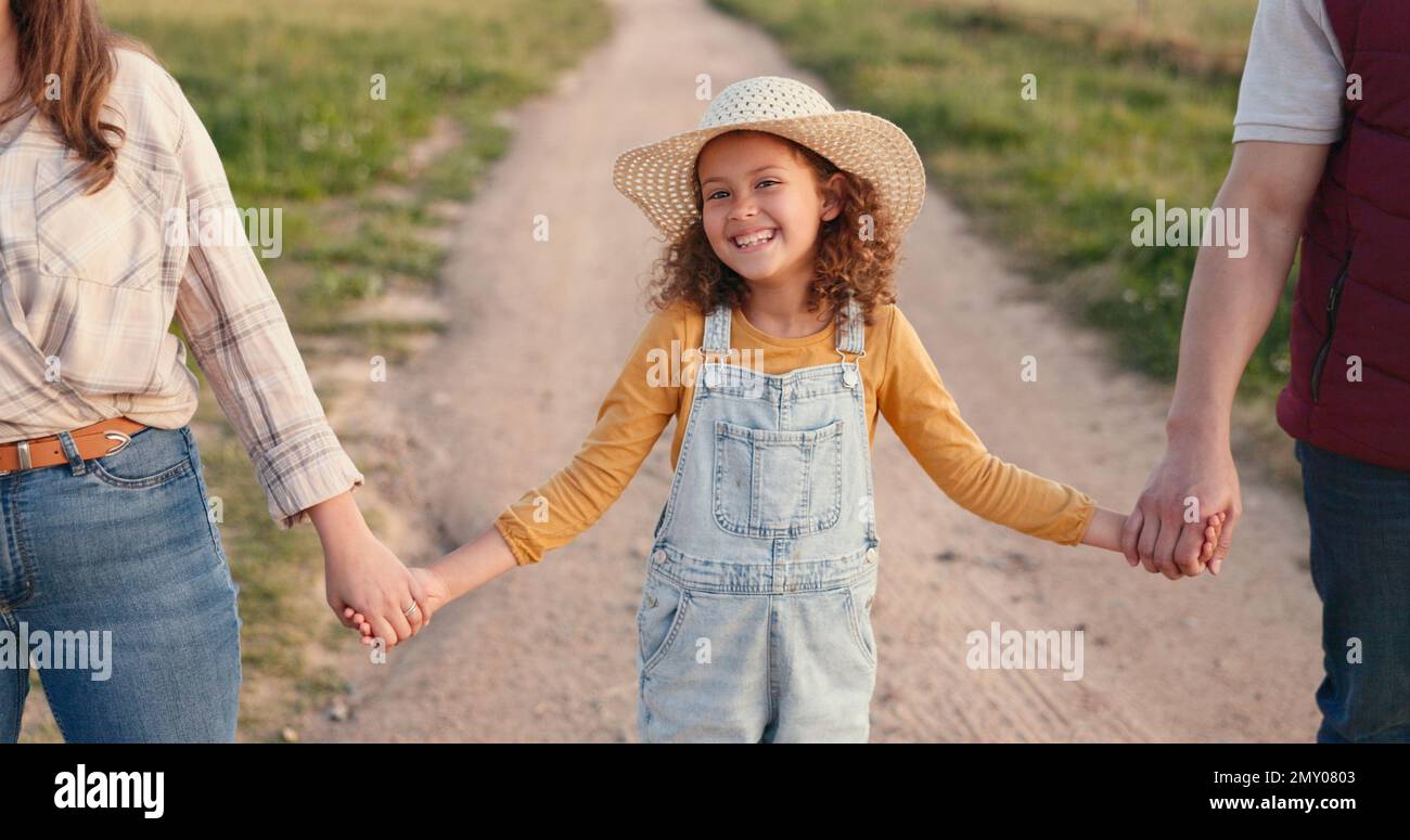 Agriculture, farming and family holding hands on farm in summer ...
