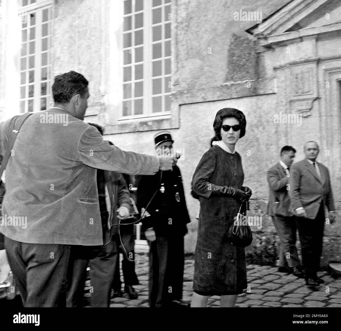 Opera diva Maria Callas is surrounded by reporters as she arrives at ...