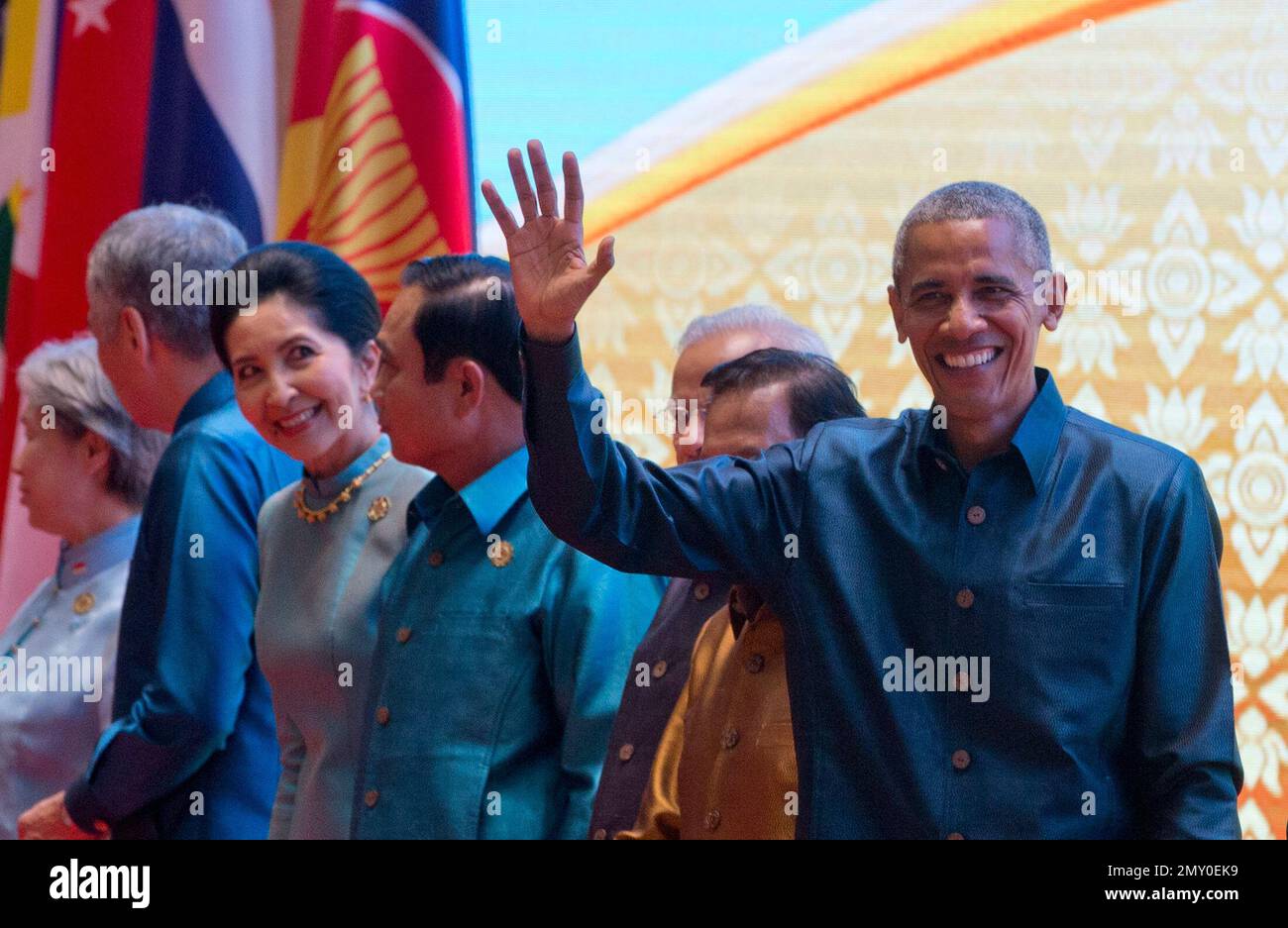 U.S. President Barack Obama waves as he poses for a group photo with ...