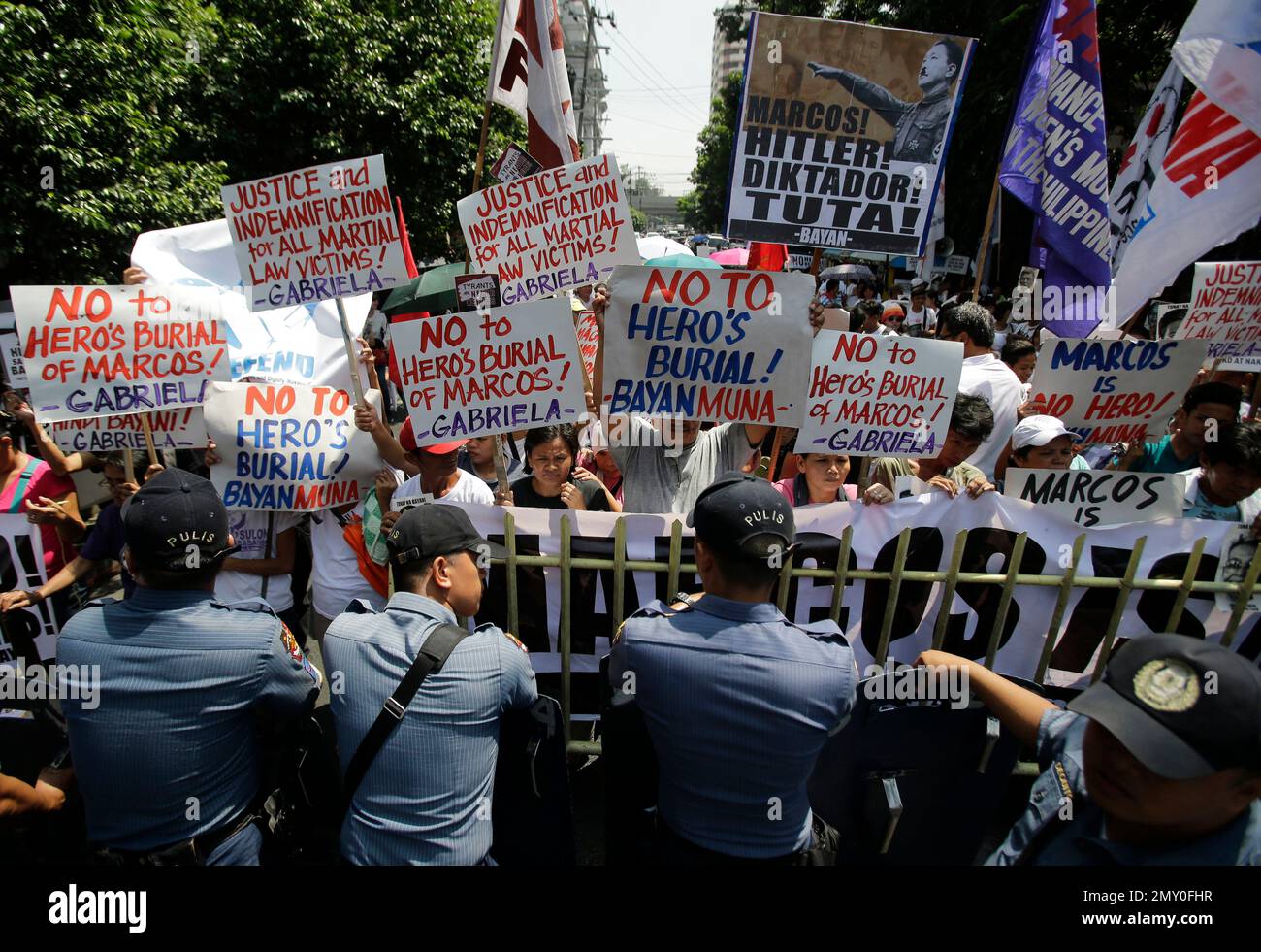 Police block protesters against the late strongman Ferdinand Marcos as ...