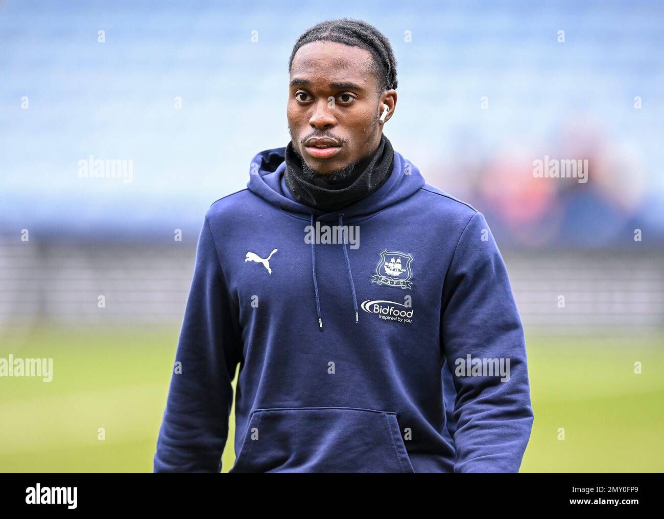 Plymouth Argyle midfielder Jay Matete (28) walks on and inspect the ...