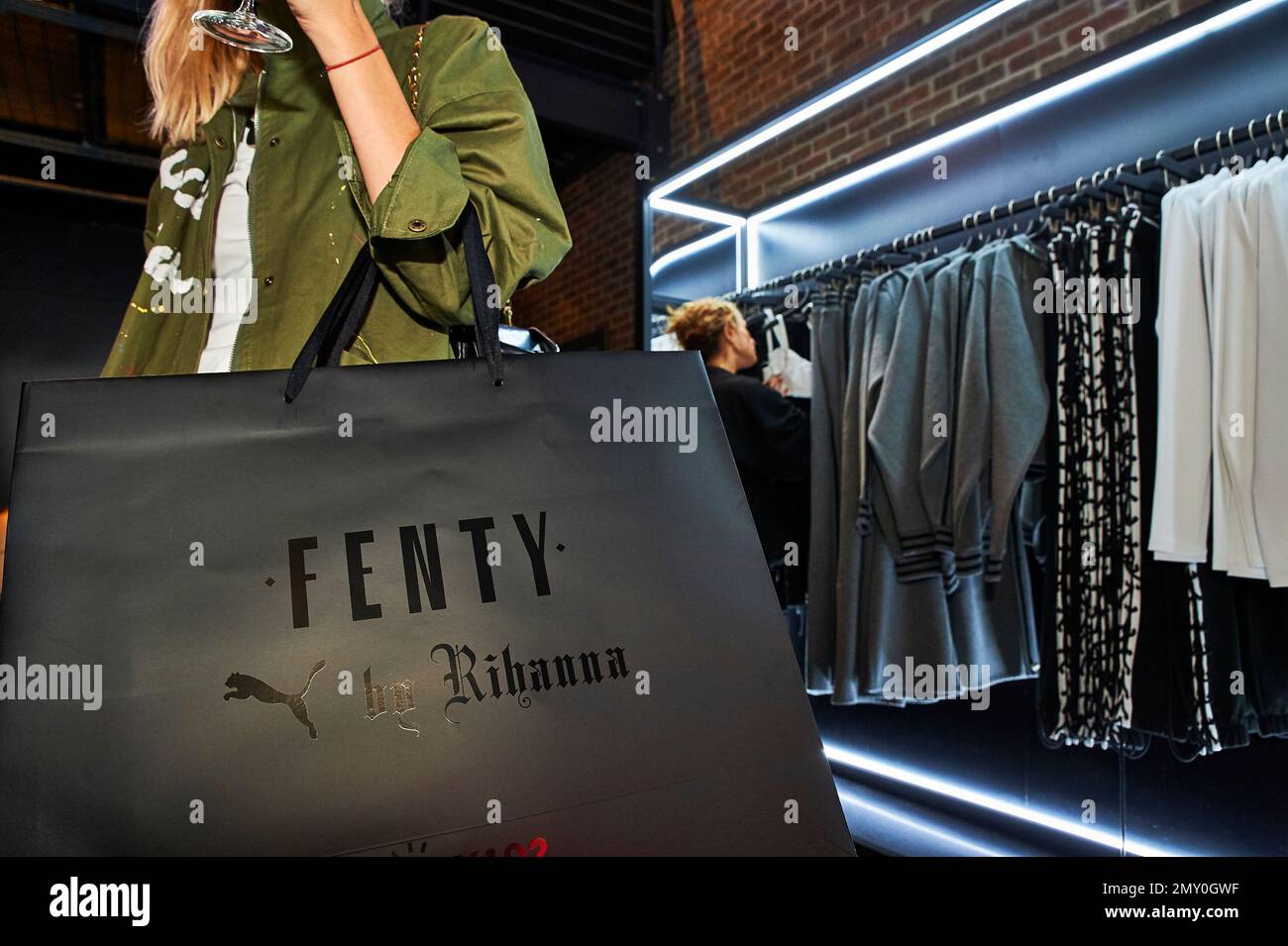 Invited customers seen looking at Rihanna's "FENTY" x Puma collection ...