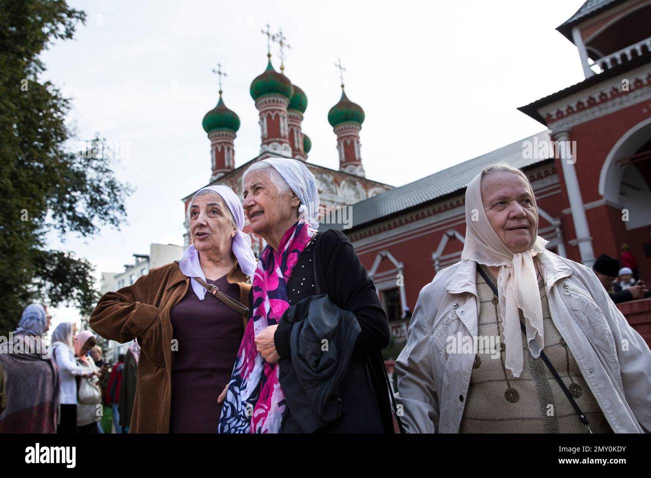 Russian Orthodox believers leave a church after a service marking the ...