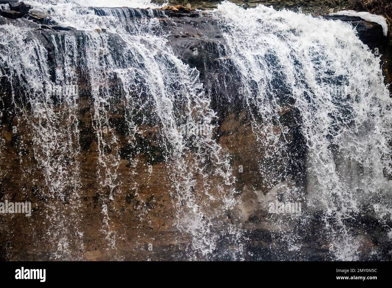 Cascade Falls waterfall on a winter day in downtown Osceola, Wisconsin ...