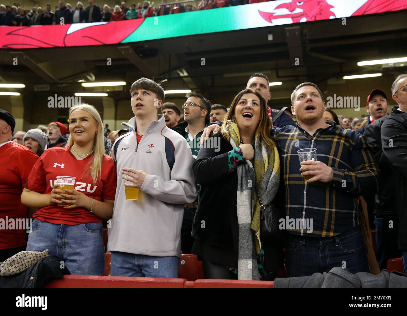 Wales fans sing the national anthem in the stands before the Guinness ...