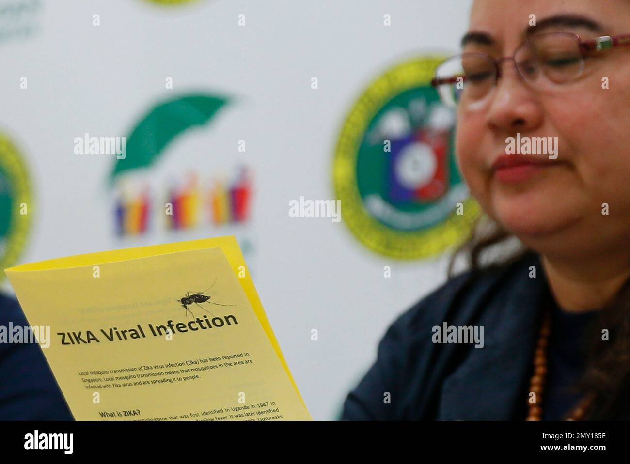 Philippine Health Secretary Paulyn Jean Rosell-Ubial reads a pamphlet ...